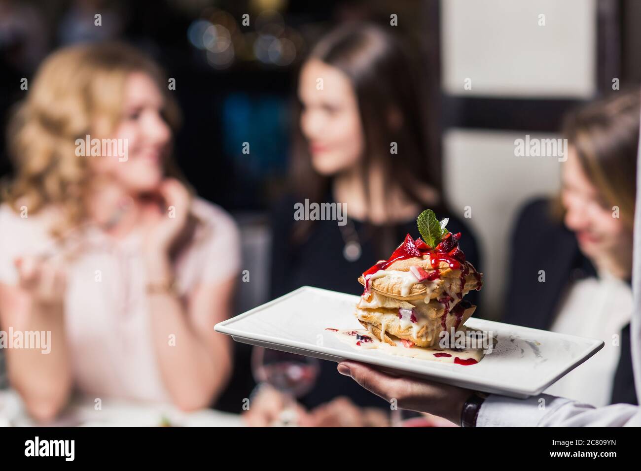 eating dessert close up. woman tasting creamy dessert Stock Photo - Alamy
