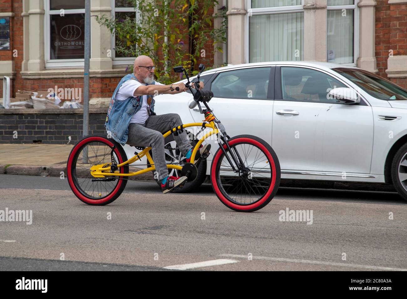 A older biker on a Chopper peddling towards town on Wellingborough road ...