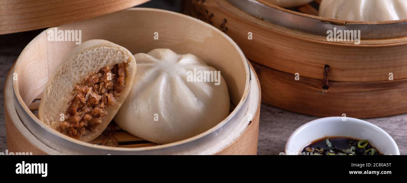 Delicious baozi, Chinese steamed meat bun is ready to eat on serving ...