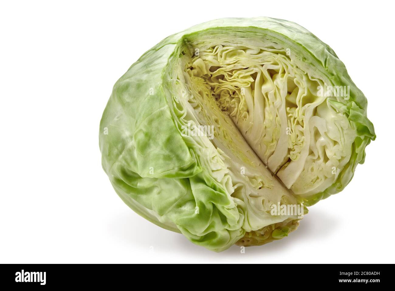 Raw, light green cabbage without one cut off piece. Isolated on white ...