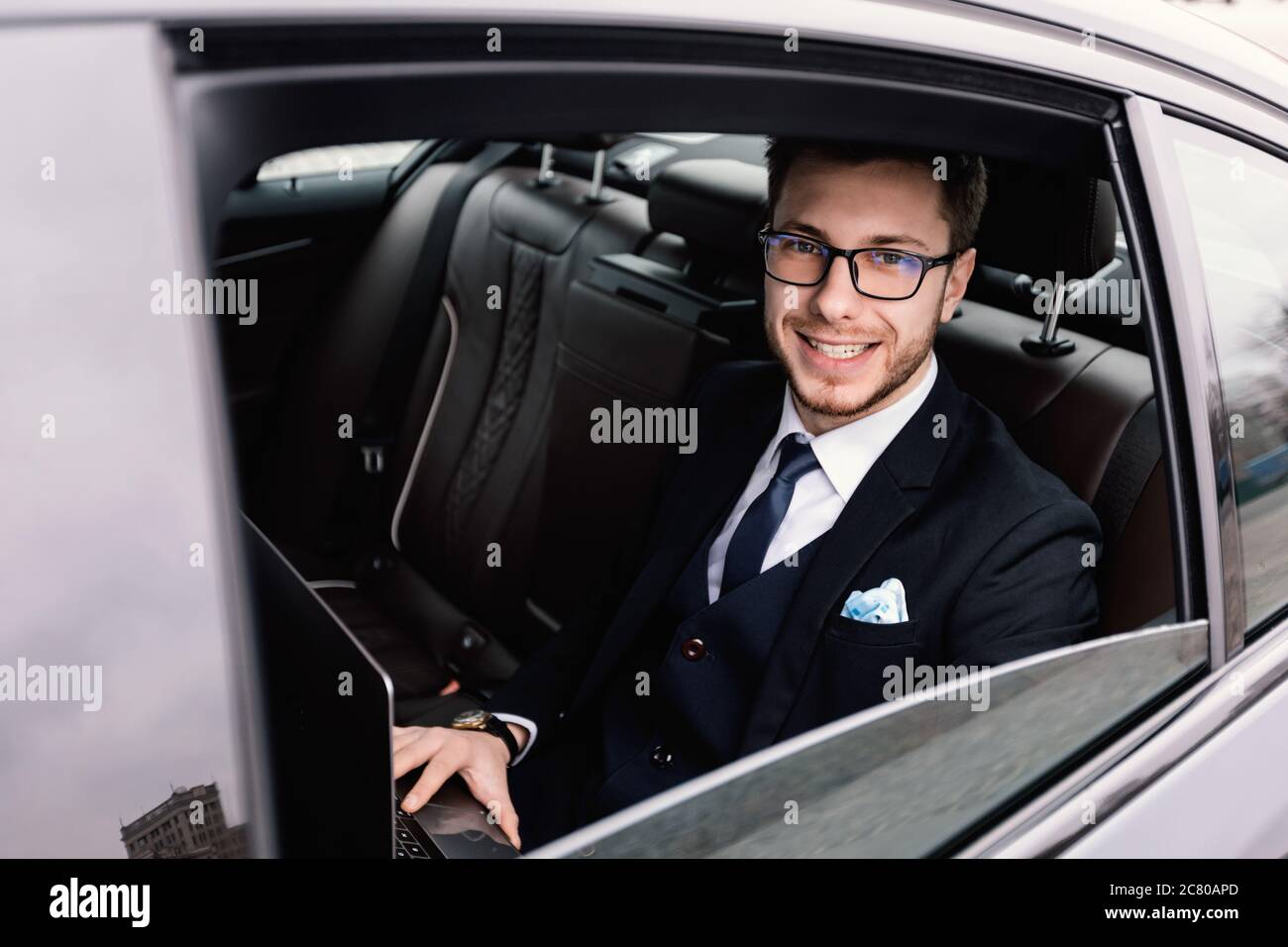 Handsome man looking out the window of the car hi-res stock photography ...