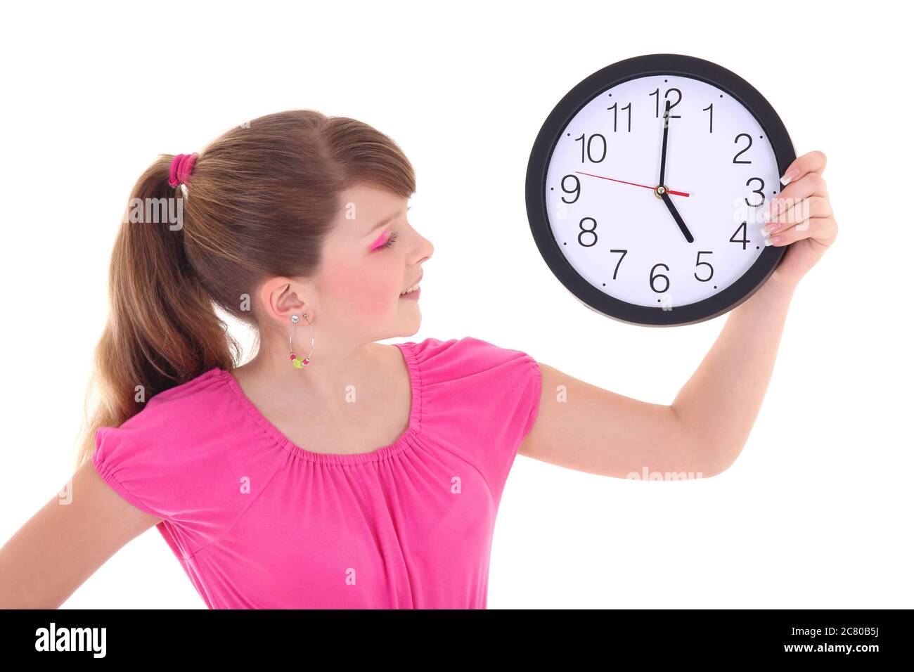 portrait of beautiful teenage girl with clock isolated over white ...