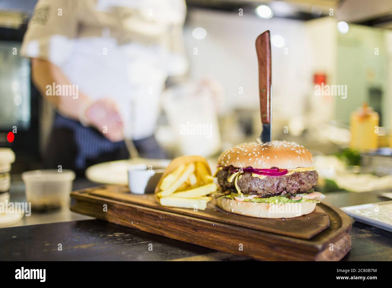 Two mouth-watering, delicious homemade burger used to chop beef. on the ...