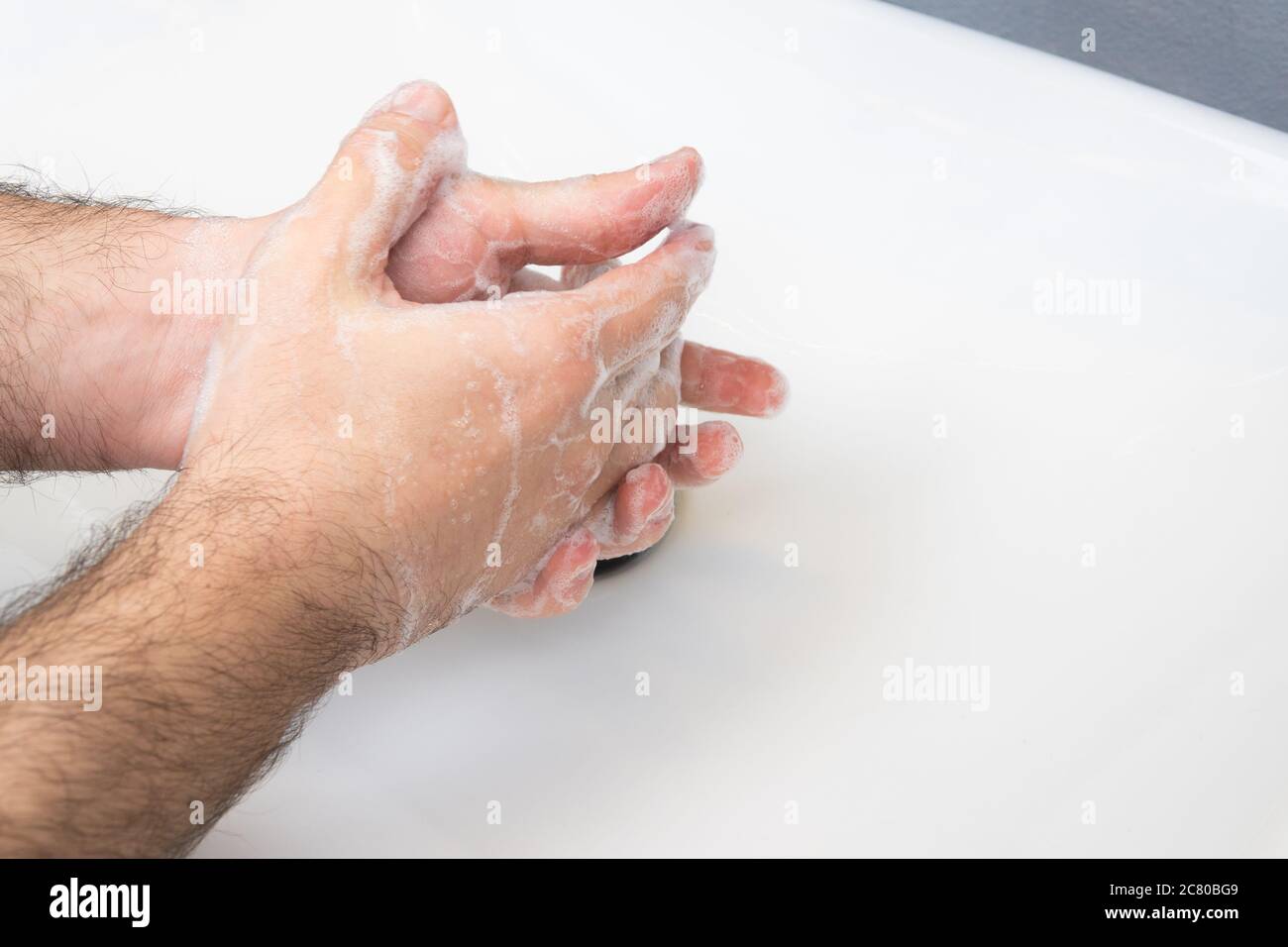 Washing hands. Hygiene concept hand and sink detail Stock Photo - Alamy