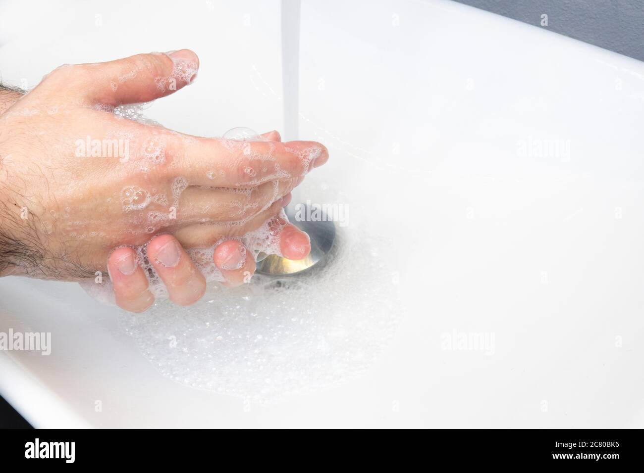 Washing hands. Hygiene concept hand and sink detail Stock Photo - Alamy