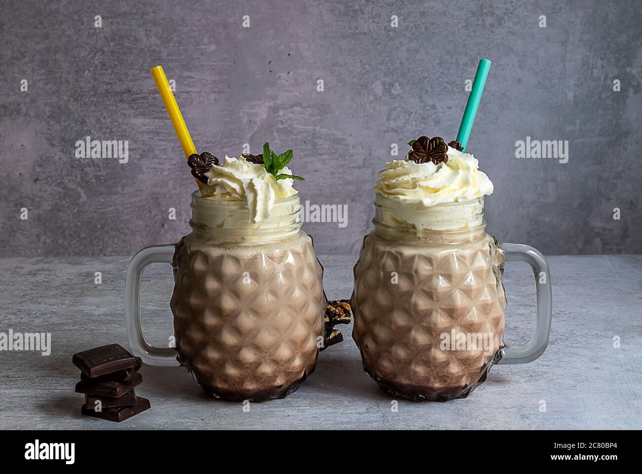 Chocolate milkshake with whipped cream, and sweets Stock Photo - Alamy