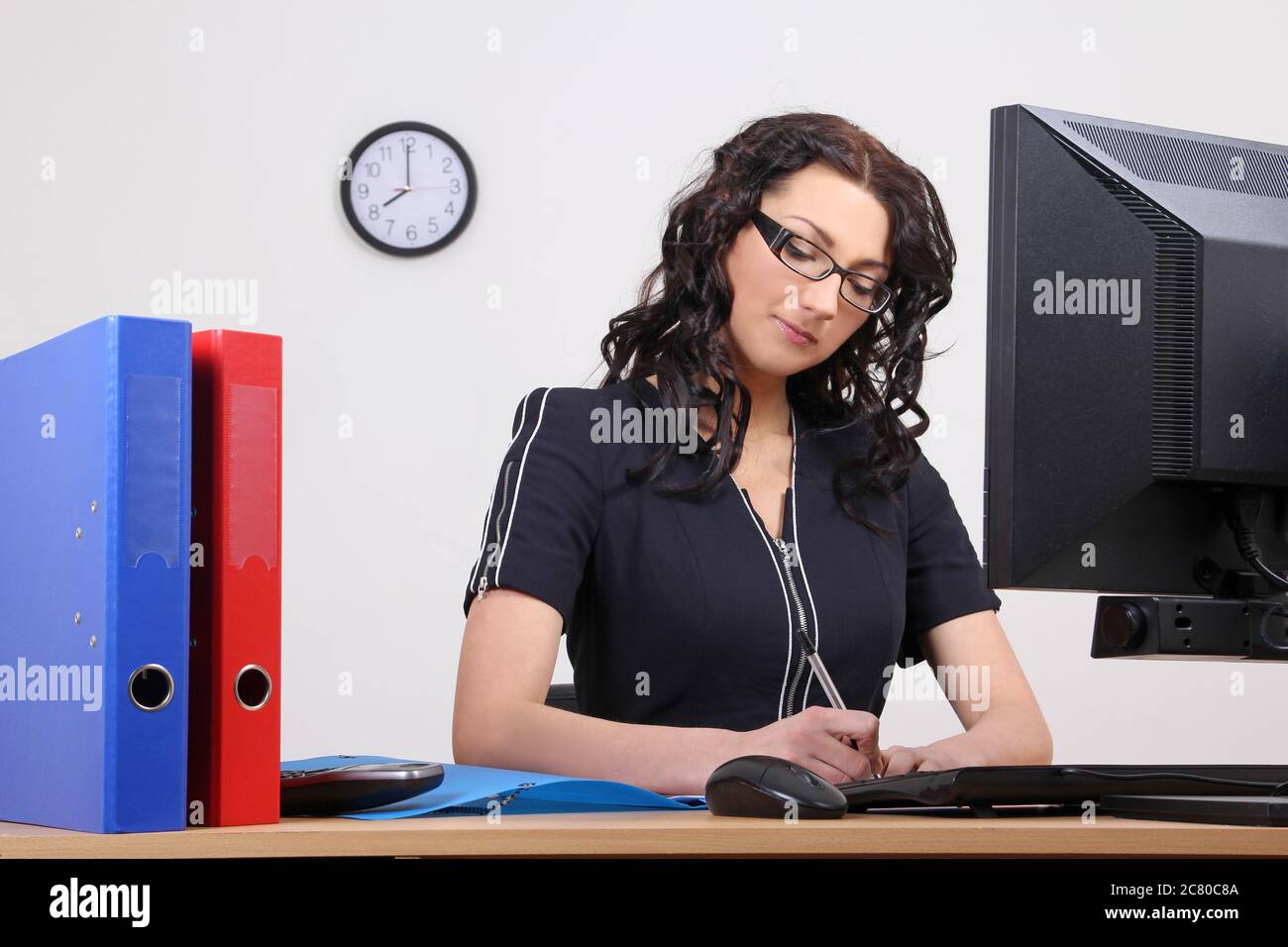 portrait of beautiful business woman sitting at her workplace Stock ...
