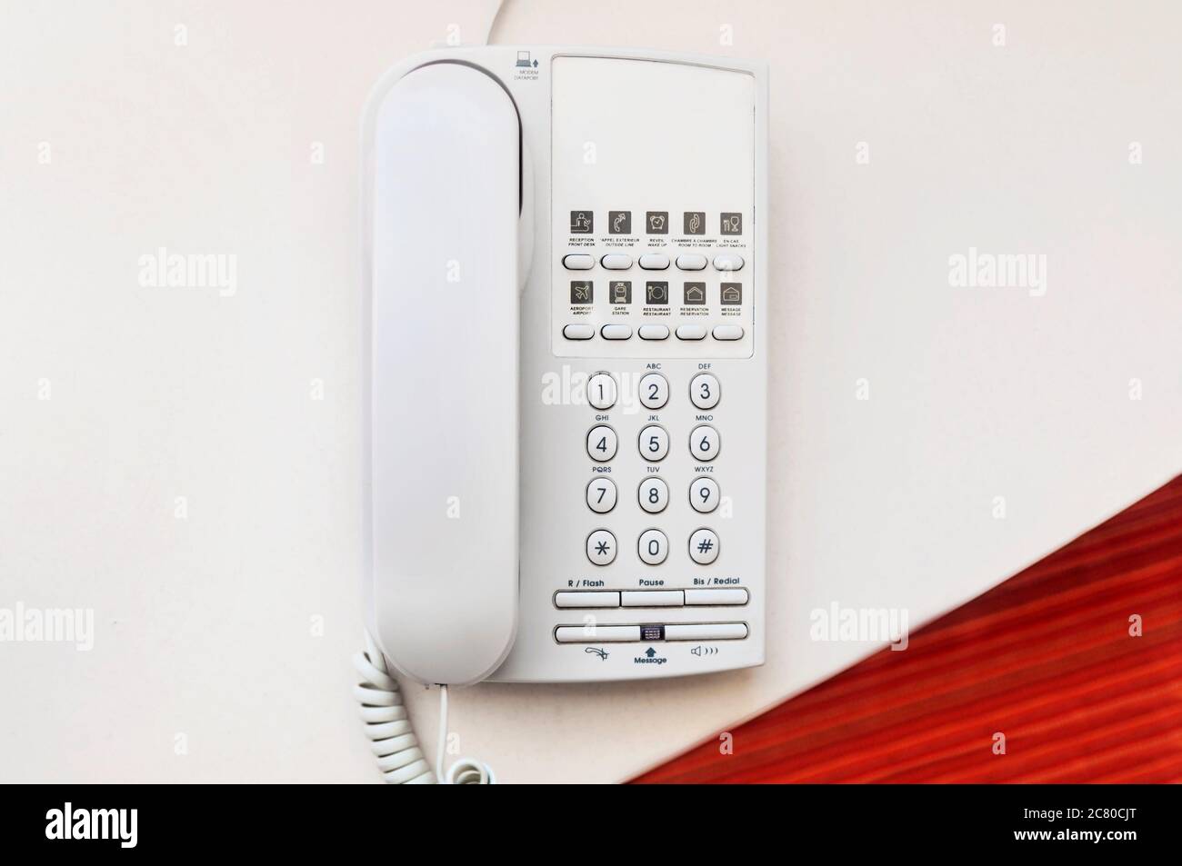 Telephone on desk in hotel room Stock Photo - Alamy