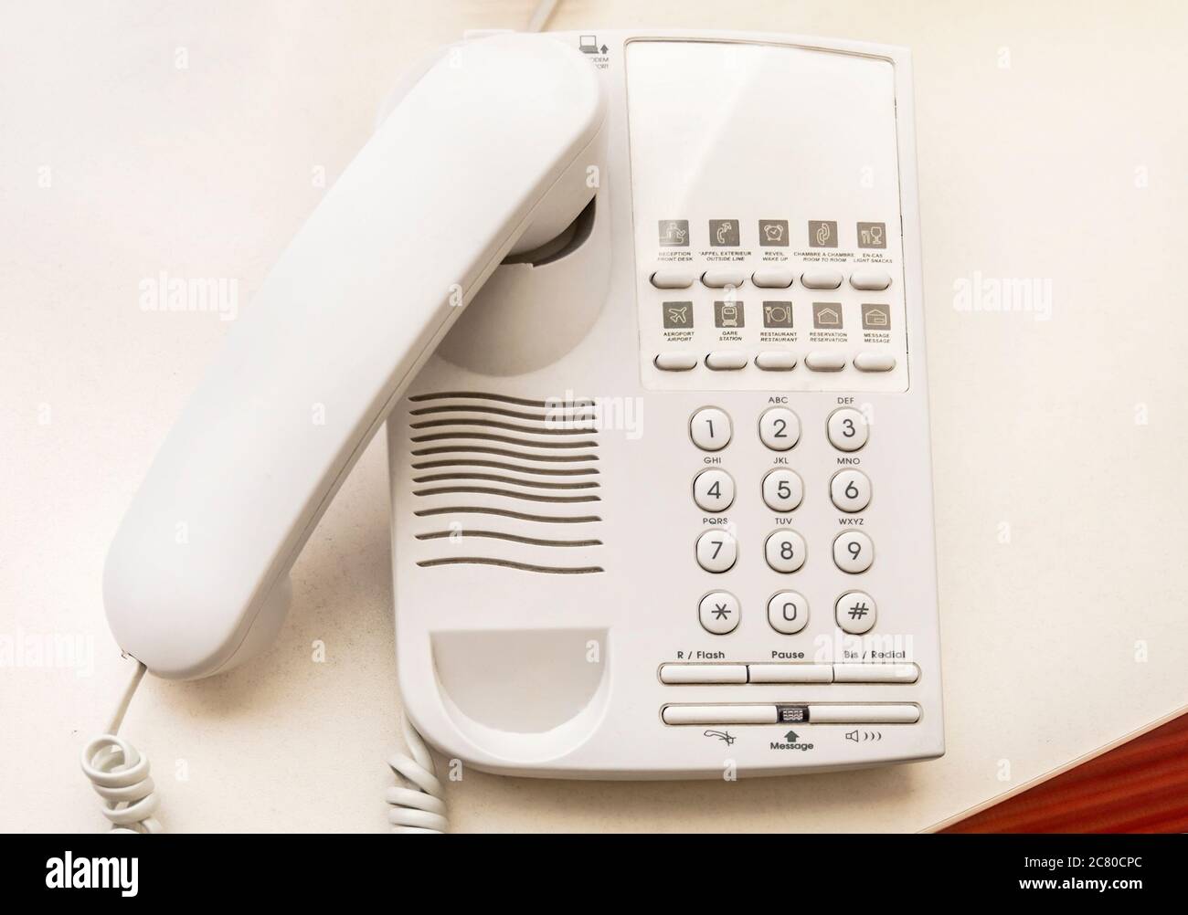 Telephone on desk in hotel room Stock Photo - Alamy