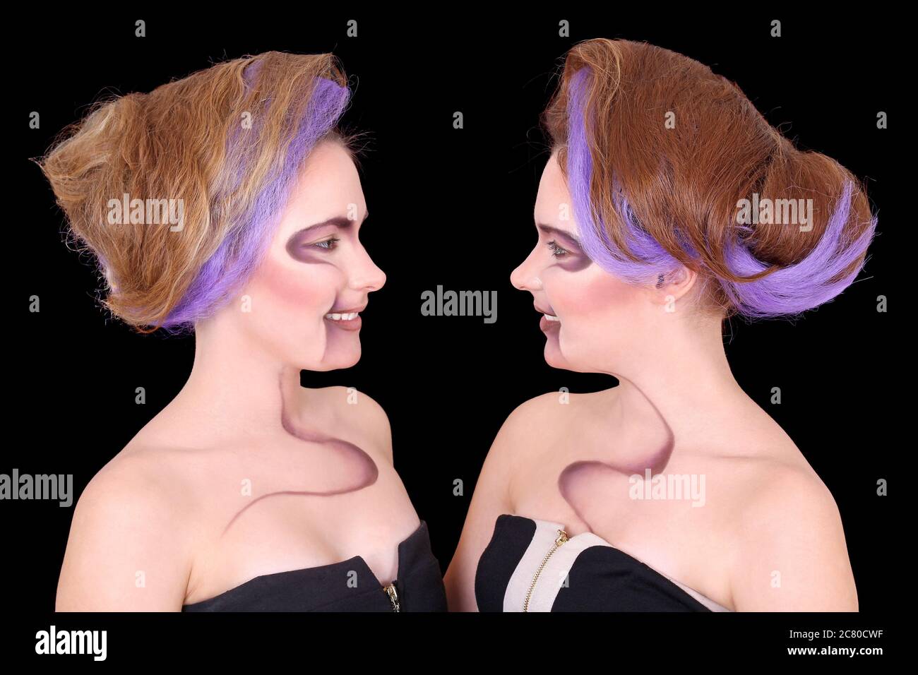 portrait of beautiful twins isolated over black Stock Photo - Alamy