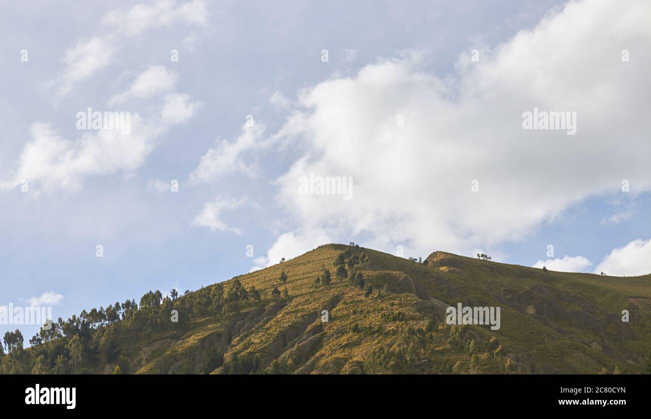Panoramic view of a hill with a cloudy day background Stock Photo - Alamy