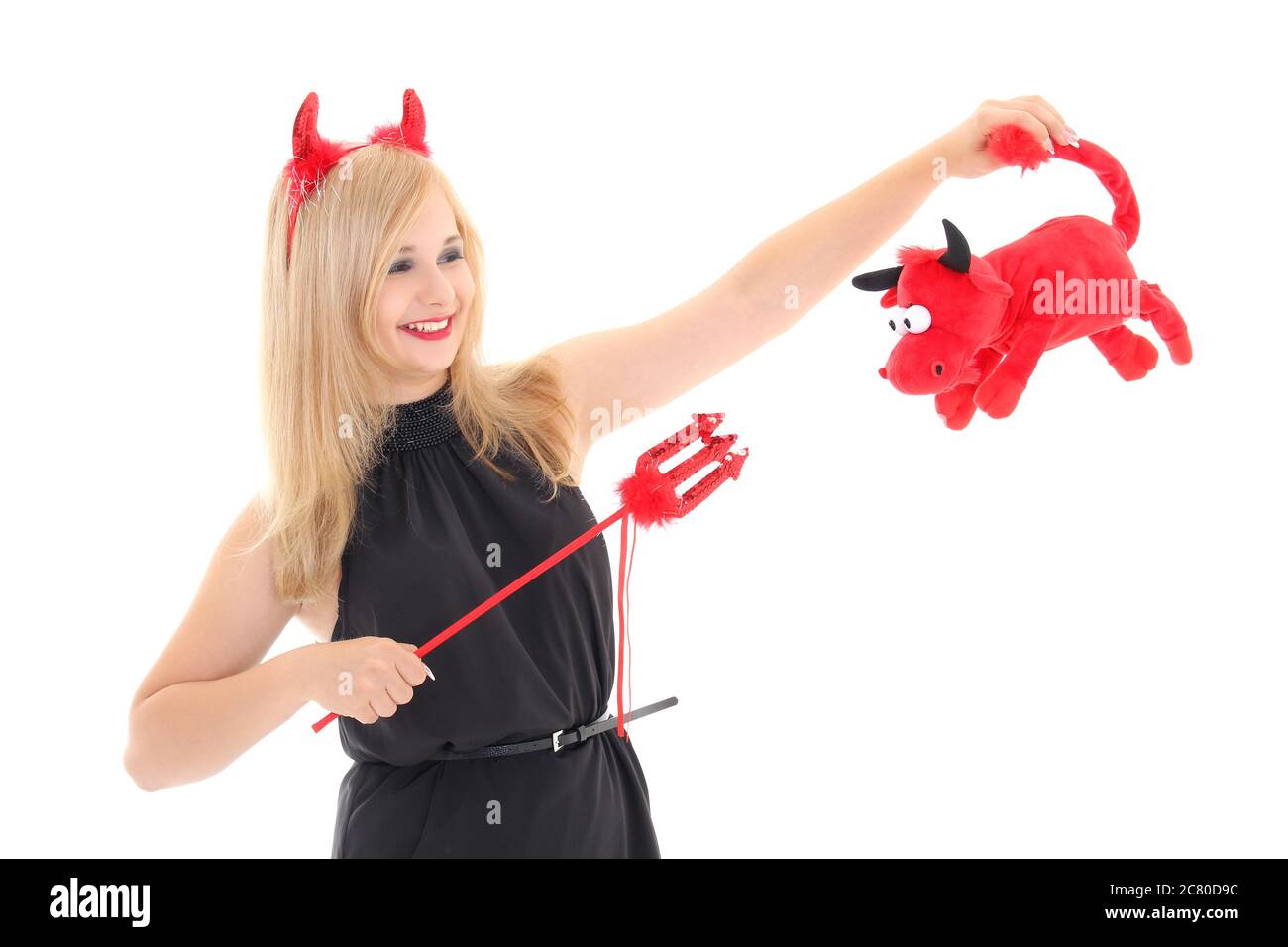Girl in imp costume with bull over white Stock Photo - Alamy