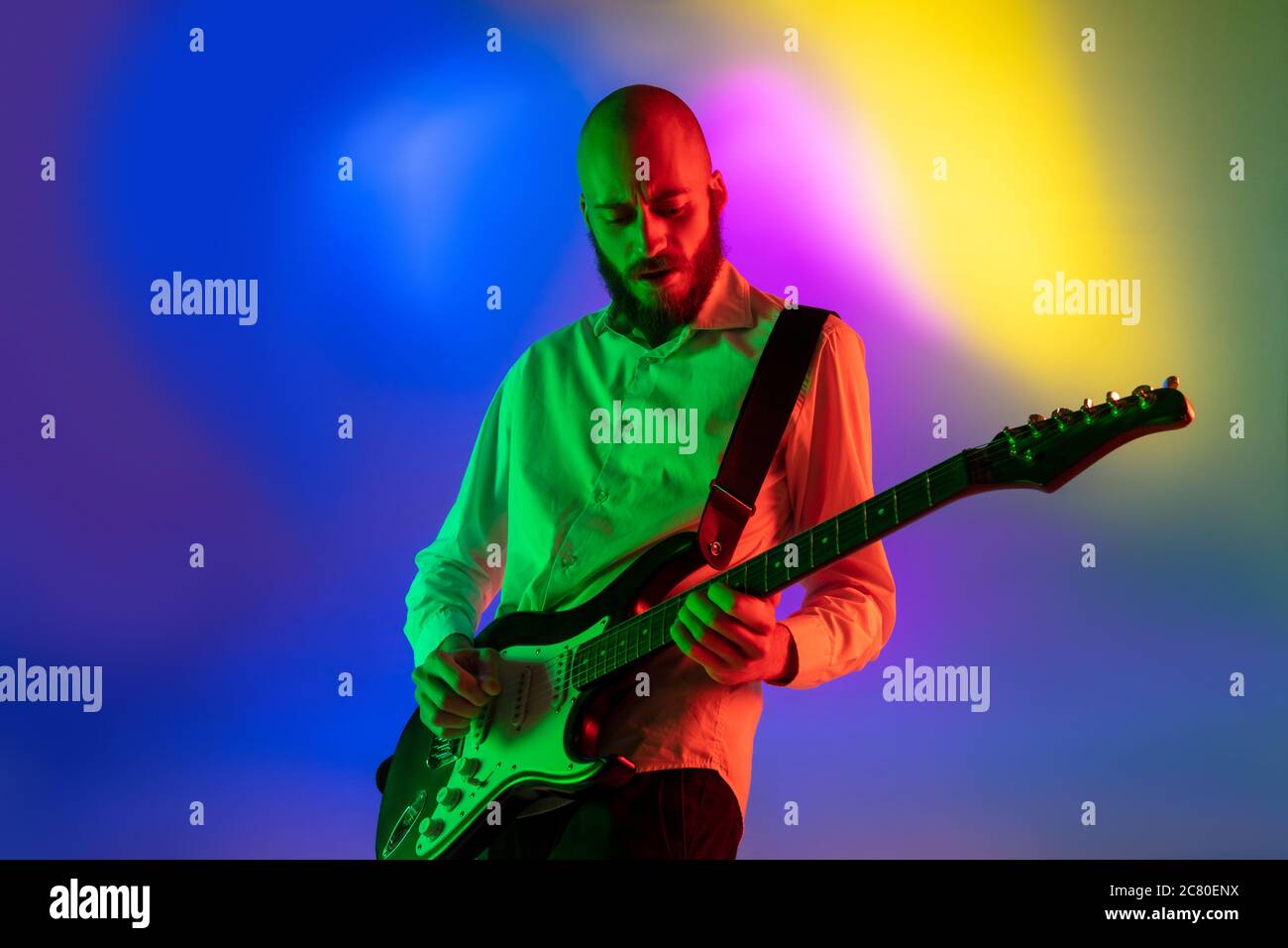 Tensioned. Young caucasian inspired and expressive musician, guitarist ...