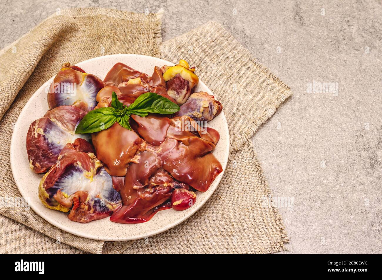 Fresh raw chicken offal: heart, liver, stomach. Dry spices, sea salt ...