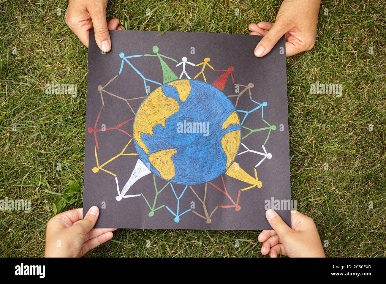 Group of people around a world map hi-res stock photography and images ...