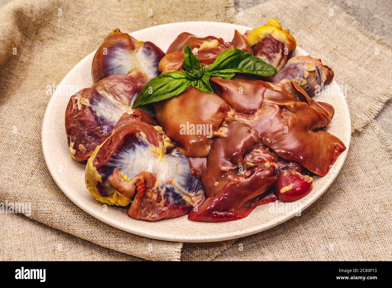 Fresh raw chicken offal: heart, liver, stomach. Dry spices, sea salt ...