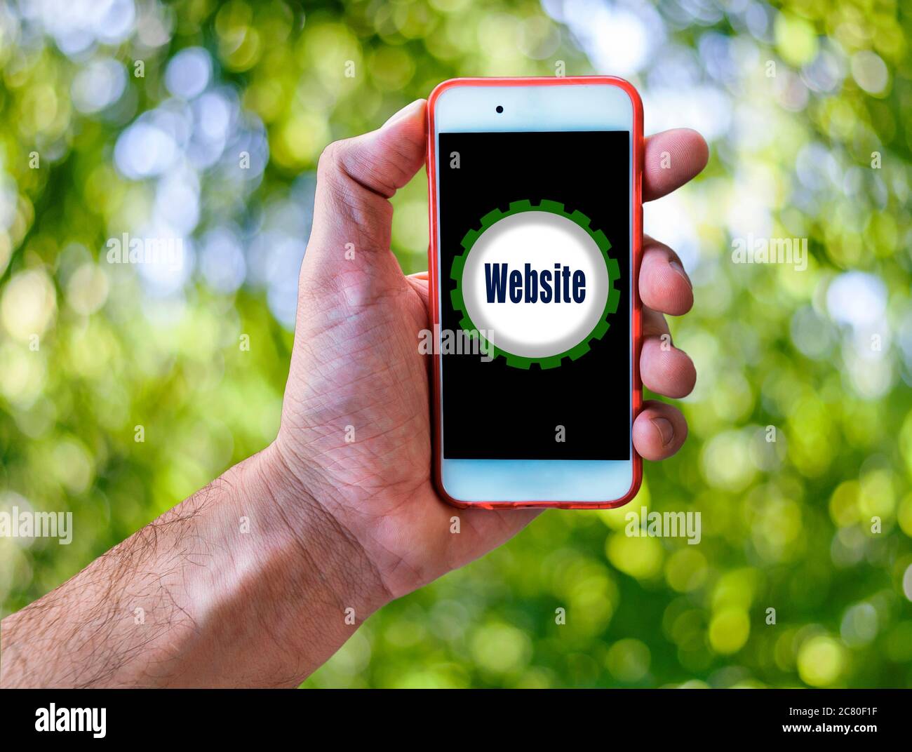 Website Marketing Concept Hand holding mobile phone Stock Photo - Alamy