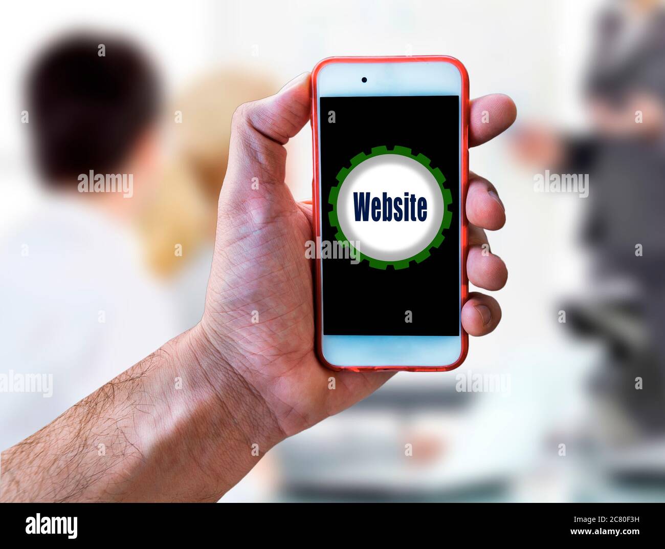 Website Marketing Concept Hand holding mobile phone Stock Photo - Alamy