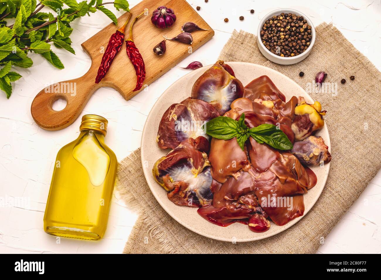 Fresh raw chicken offal: heart, liver, stomach. Dry spices, sea salt ...