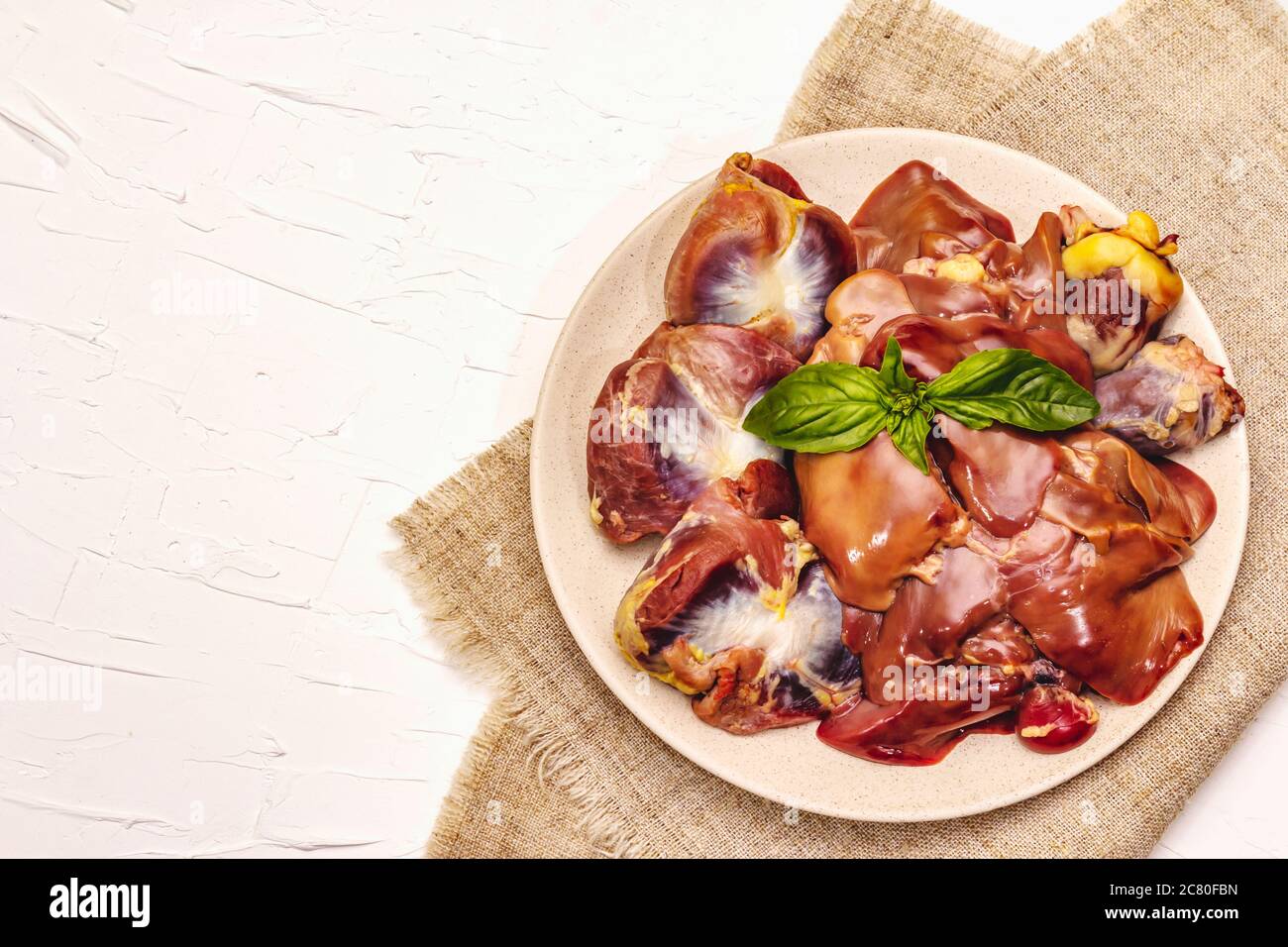 Fresh raw chicken offal: heart, liver, stomach. Dry spices, sea salt ...