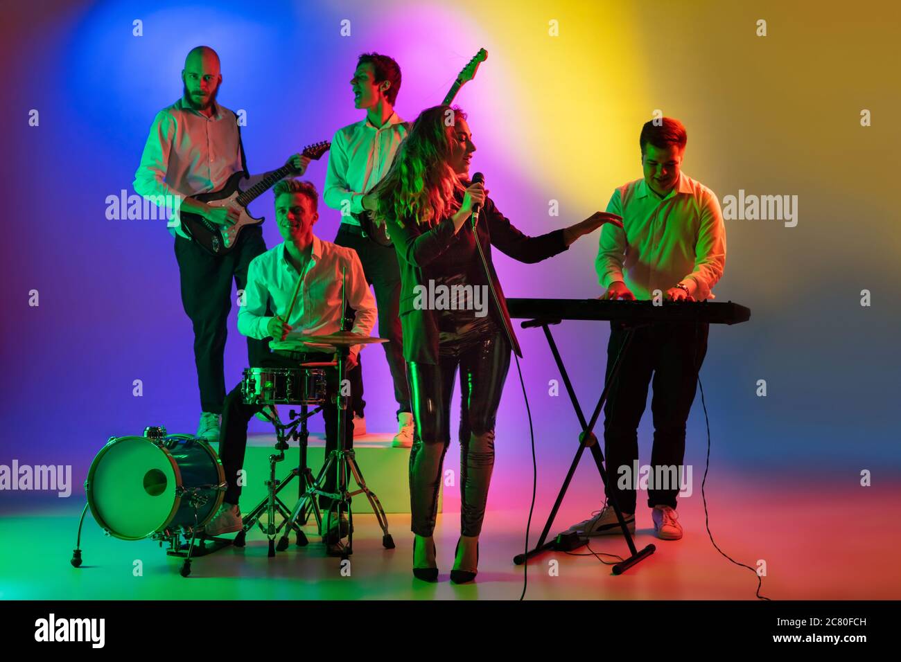 Motion. Young caucasian inspired and expressive musicians, band ...