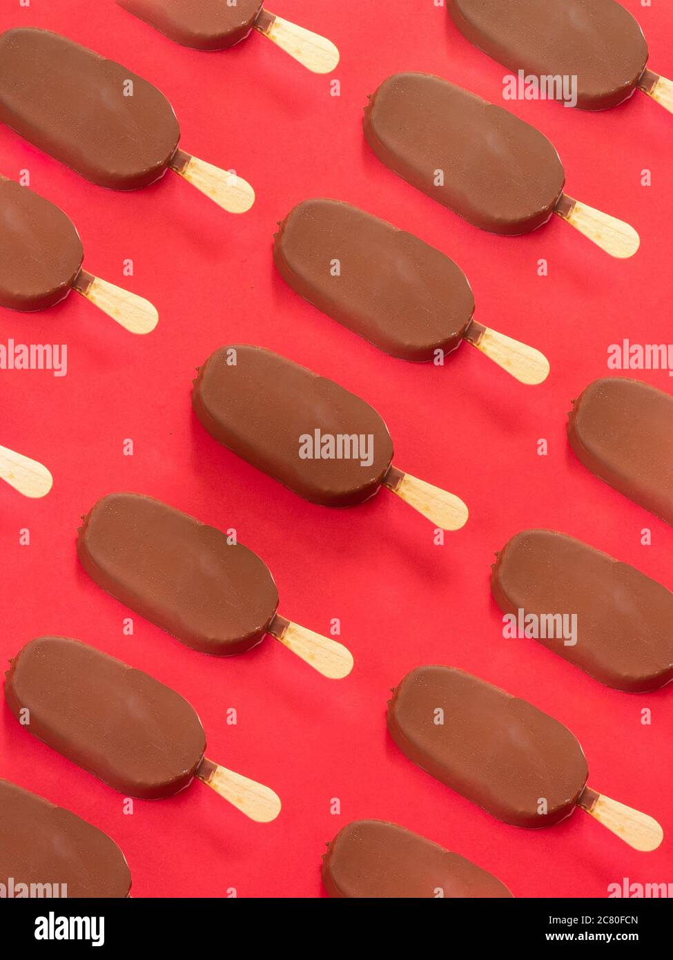 Chocolate ice cream pattern on red background Stock Photo - Alamy