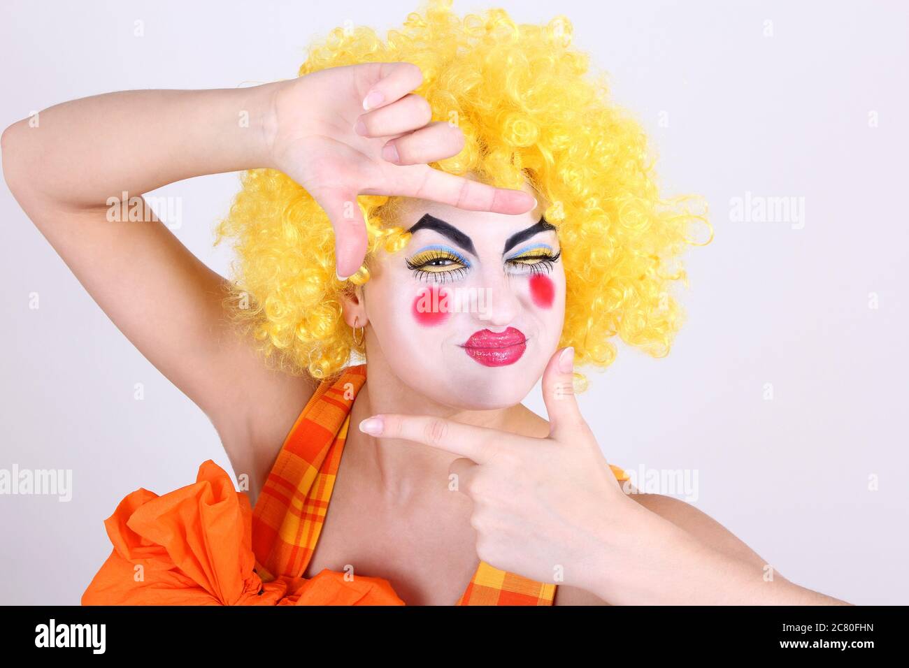 Happy clown in costume take a photo Stock Photo - Alamy