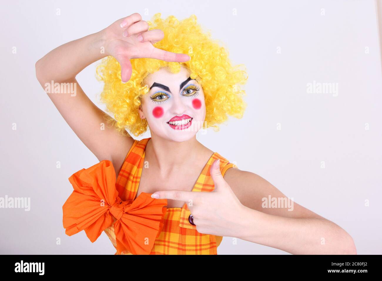 Happy clown in costume take a photo Stock Photo - Alamy