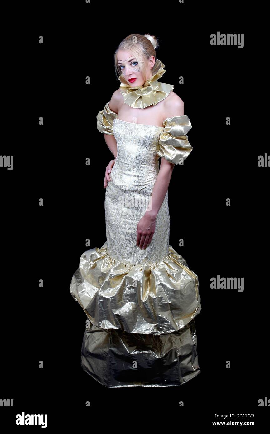 Beautiful woman in golden venetian dress over black Stock Photo - Alamy