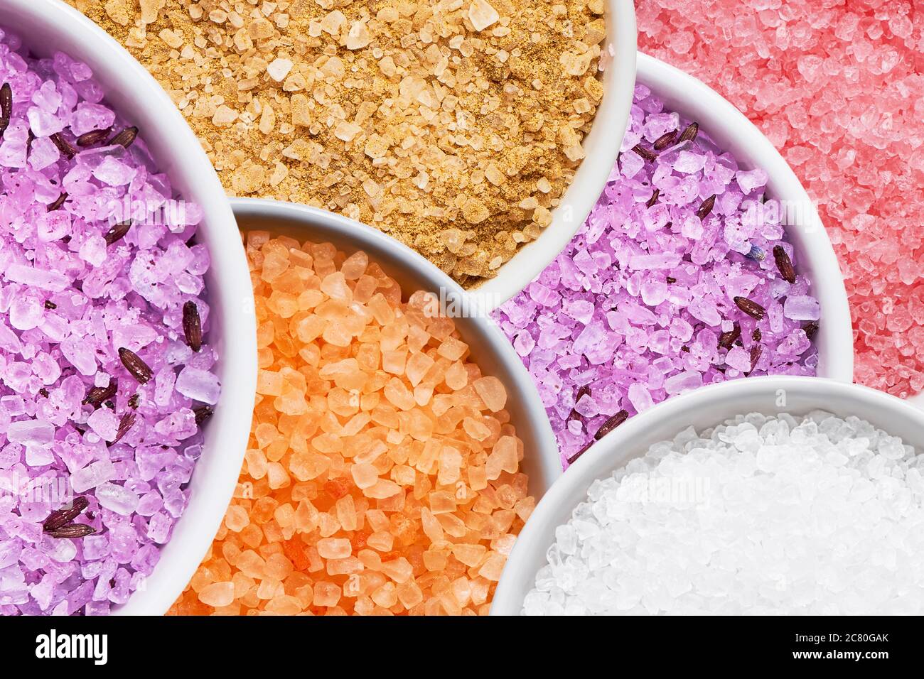 Colorful bath salt. Collage of bath salt in bowl. Top view. SPA concept ...