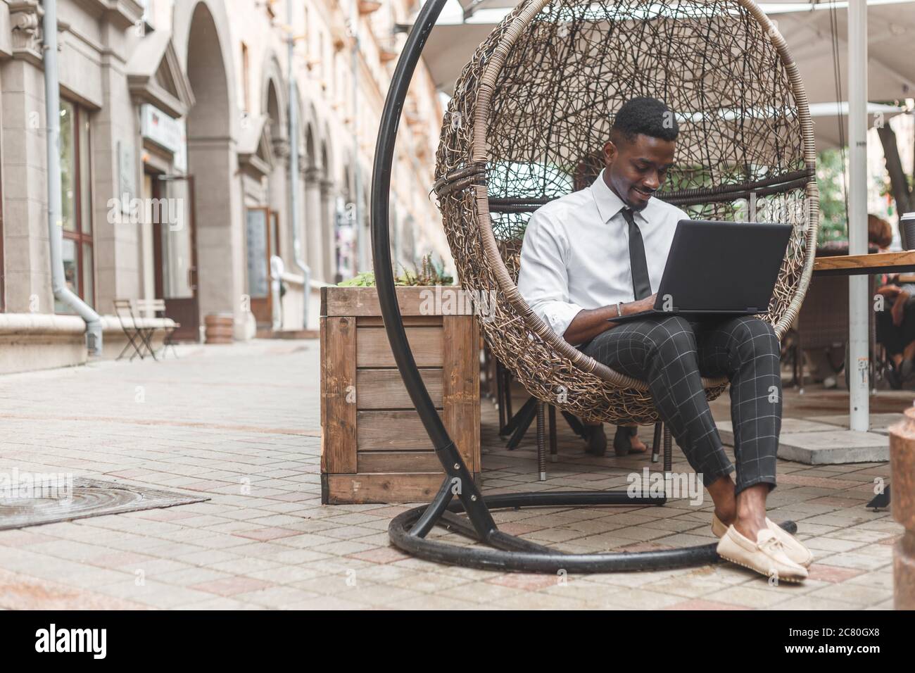 African male laptop outside hi-res stock photography and images - Alamy