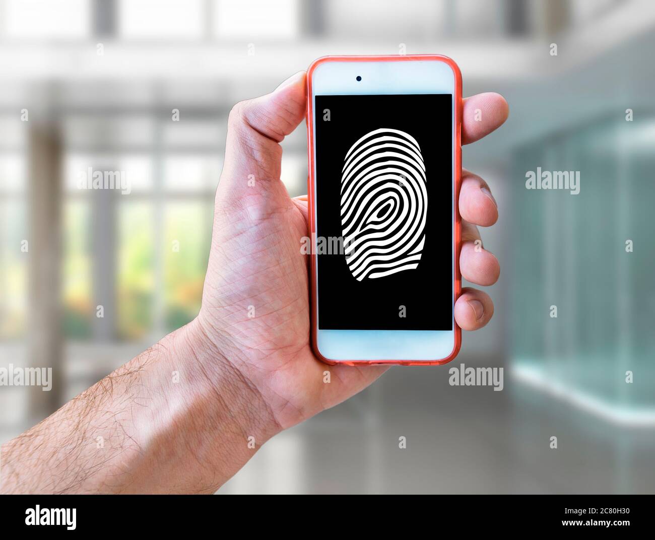 Fingerprint and Hand holding mobile phone Stock Photo - Alamy