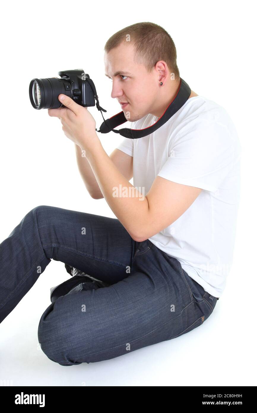 photographer with dslr camera sitting isolated over white background ...