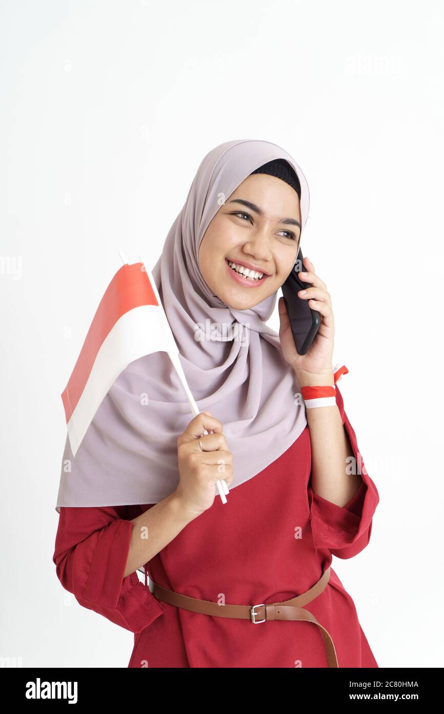 beautiful asian woman calling using smartphone during independence day ...