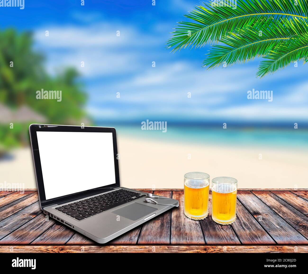 Laptop screen on wooden bench at the beach Stock Photo - Alamy
