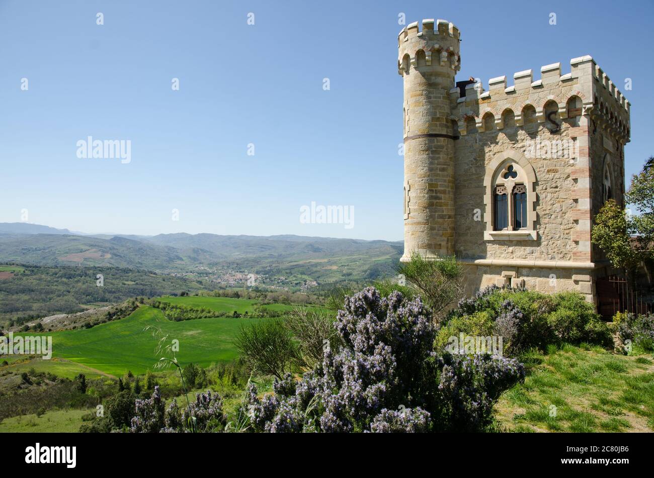 Magdala tower in front of a green meadow in Rennes-le-Chateau, France ...