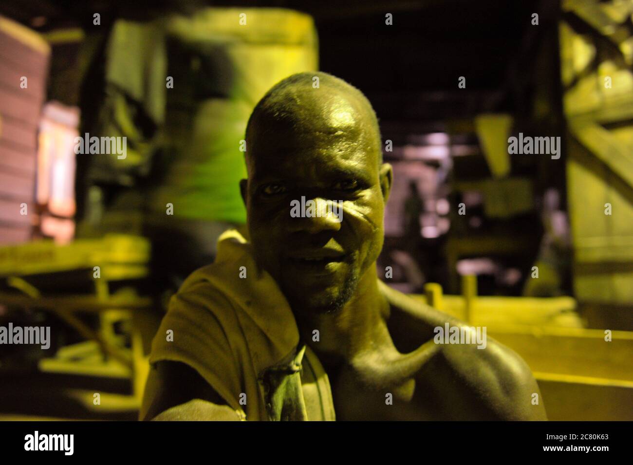 Men working in a bakery baking bread. They usually work at night, by ...