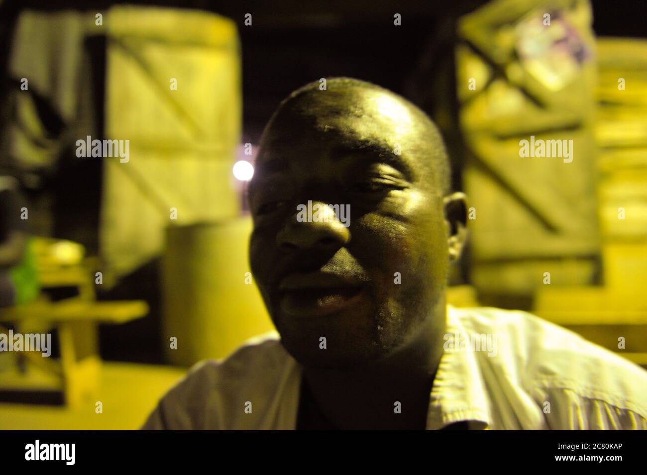 Men working in a bakery baking bread. They usually work at night, by ...