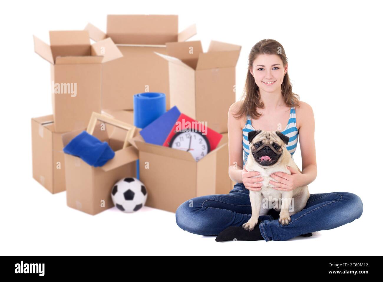 moving day concept - young woman with brown cardboard boxes and cute ...