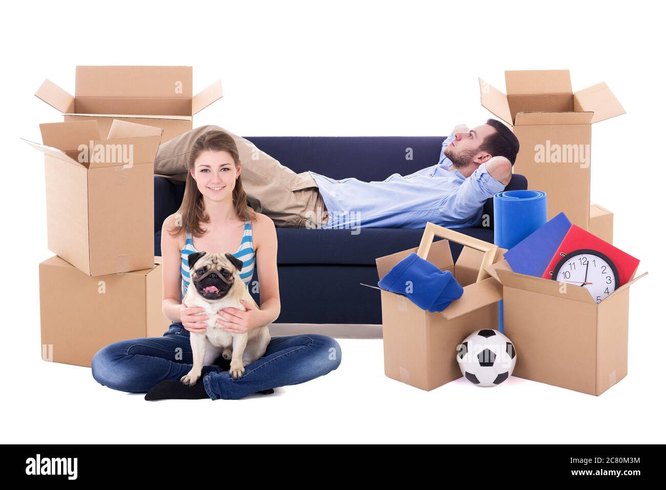moving day concept - young couple with brown cardboard boxes with stuff ...