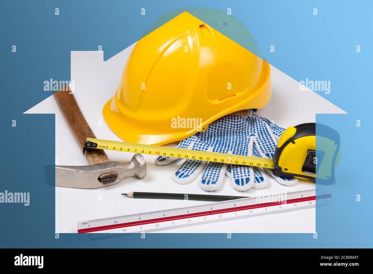 construction concept - close up of builder's work tools in blue house ...