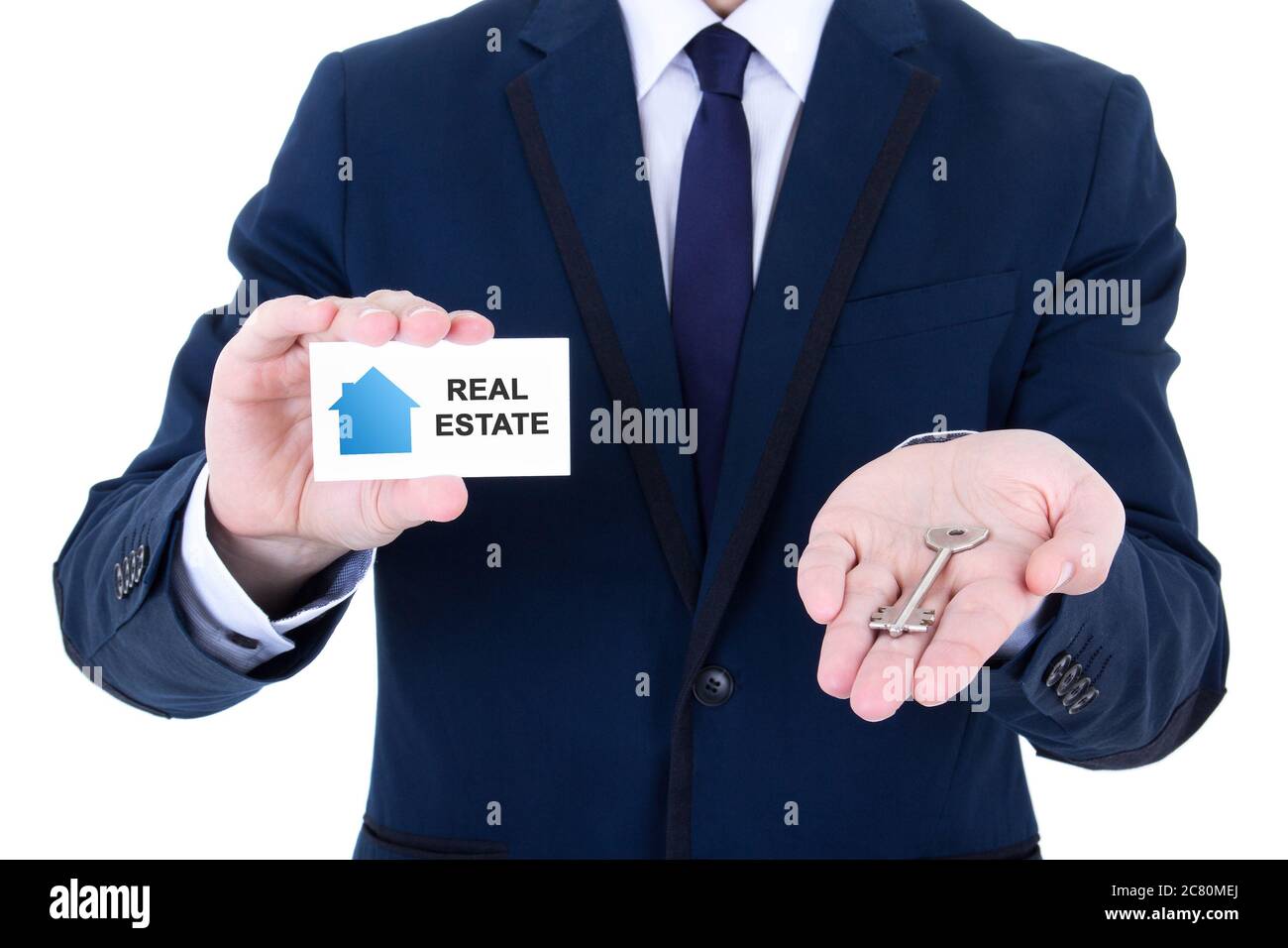 key and visiting card in male real estate agent hand isolated on white ...