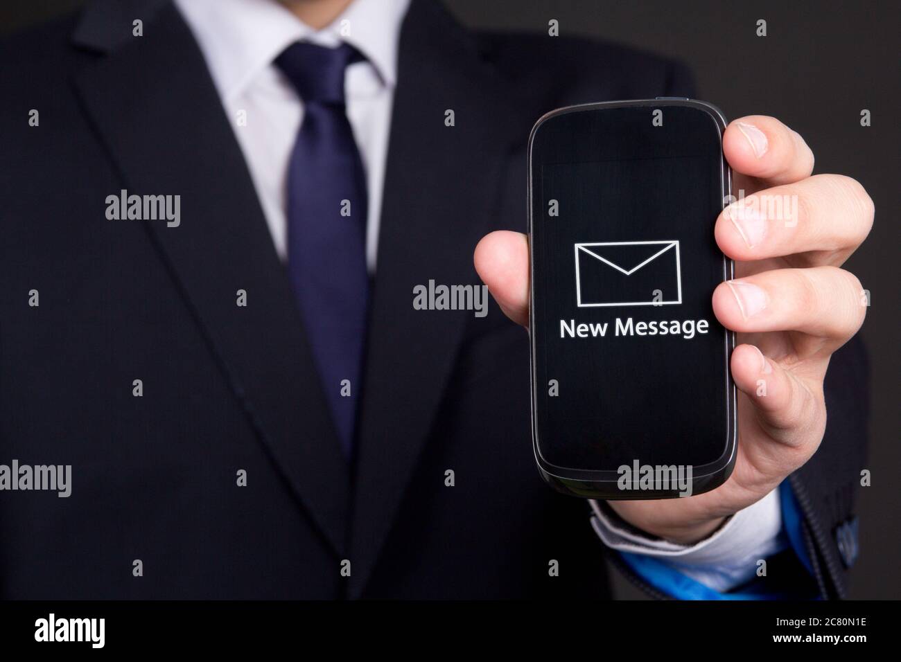 modern mobile phone with new message in business man hand Stock Photo ...