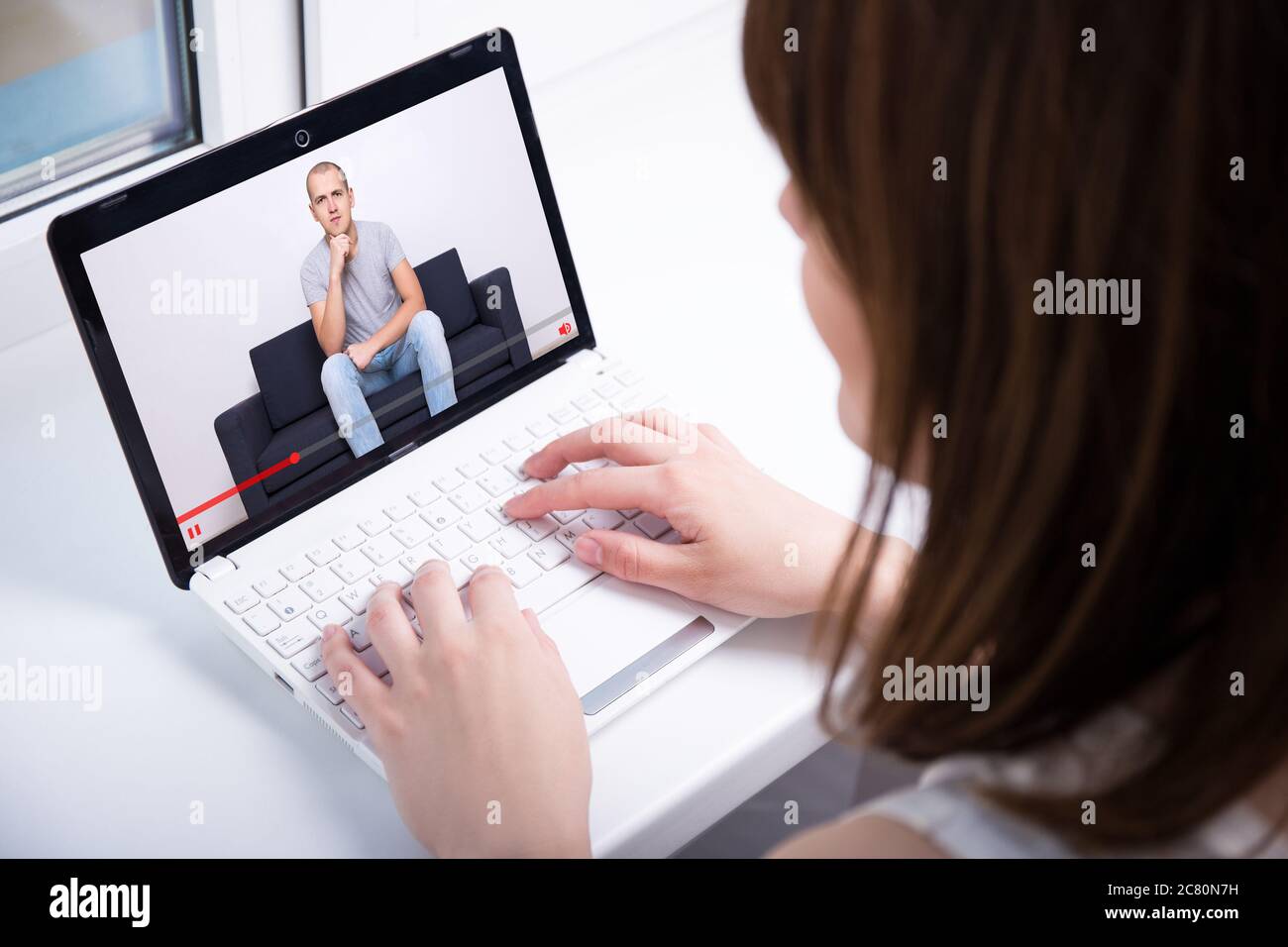 Back view video man sitting hi-res stock photography and images - Alamy