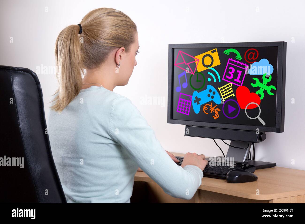 back view of woman with personal computer using media applications in ...