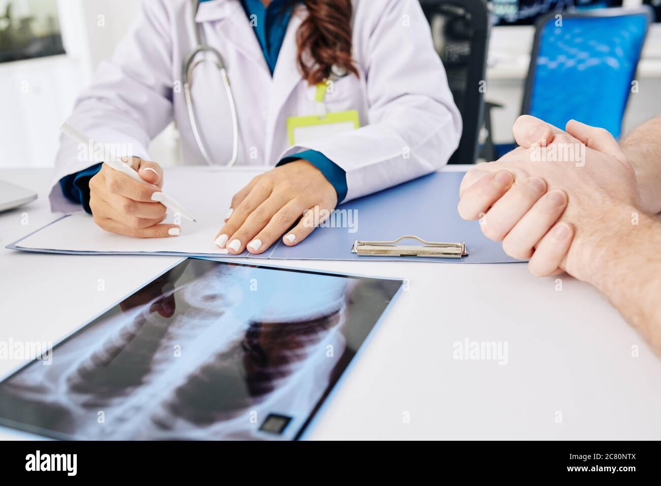 Doctor taking notes contagious patient hi-res stock photography and ...
