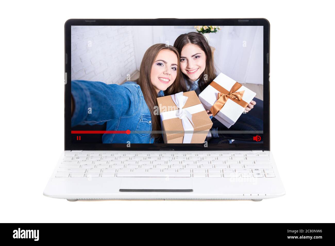 blog concept - two beautiful girls bloggers with gift boxes on laptop ...
