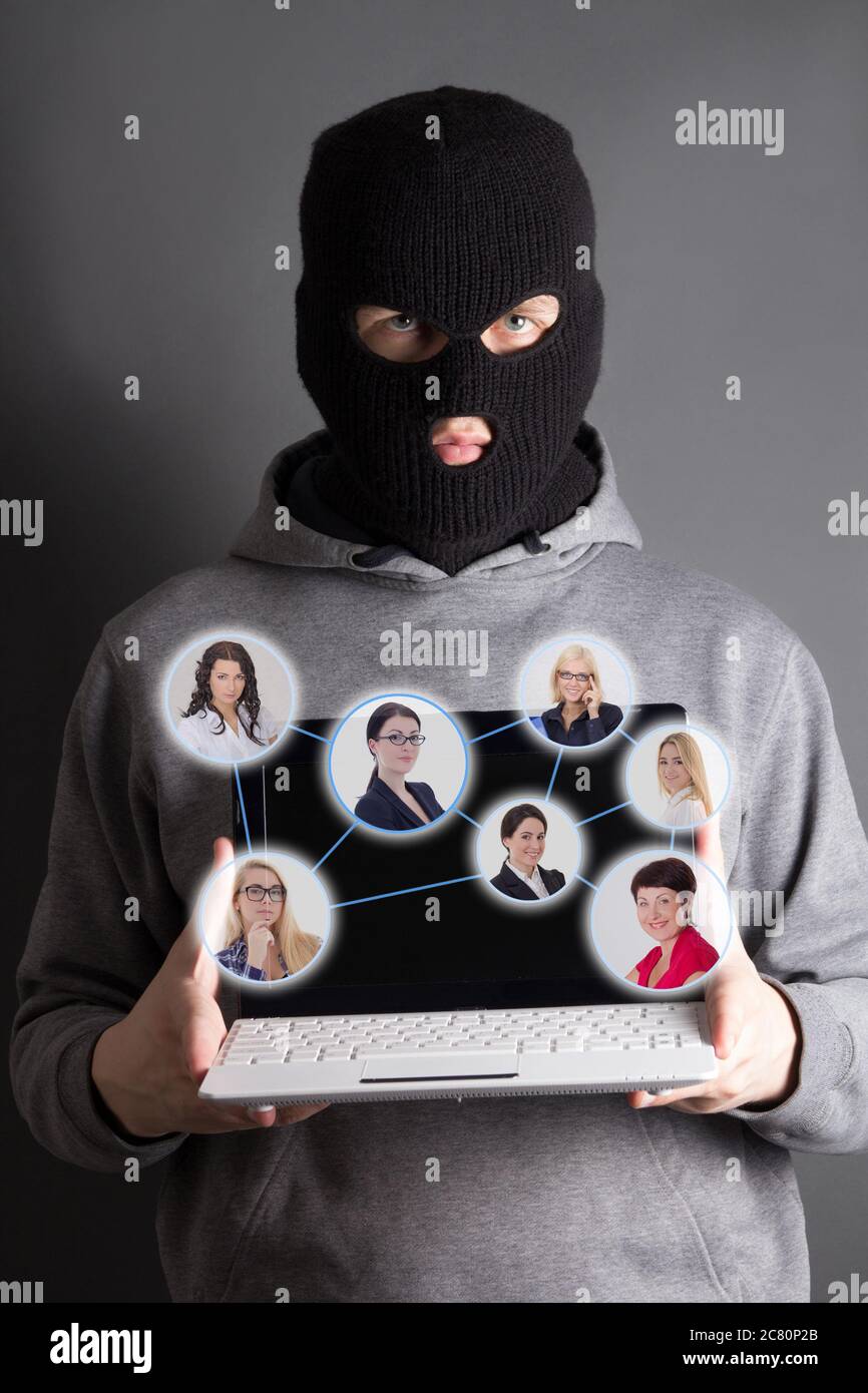 internet security concept - masked hacker stealing data from internet ...