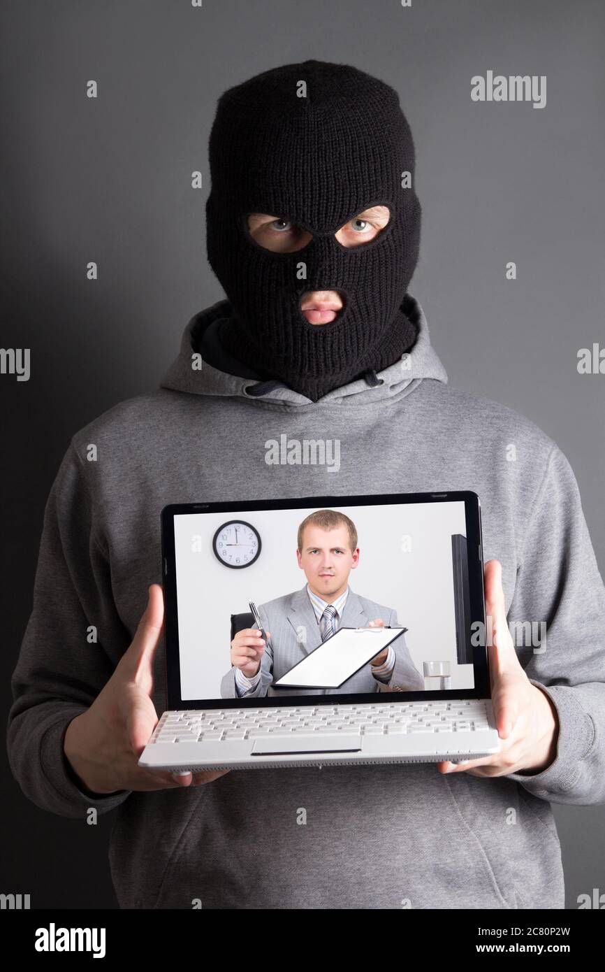 masked man with computer - concept picture of internet crime Stock ...