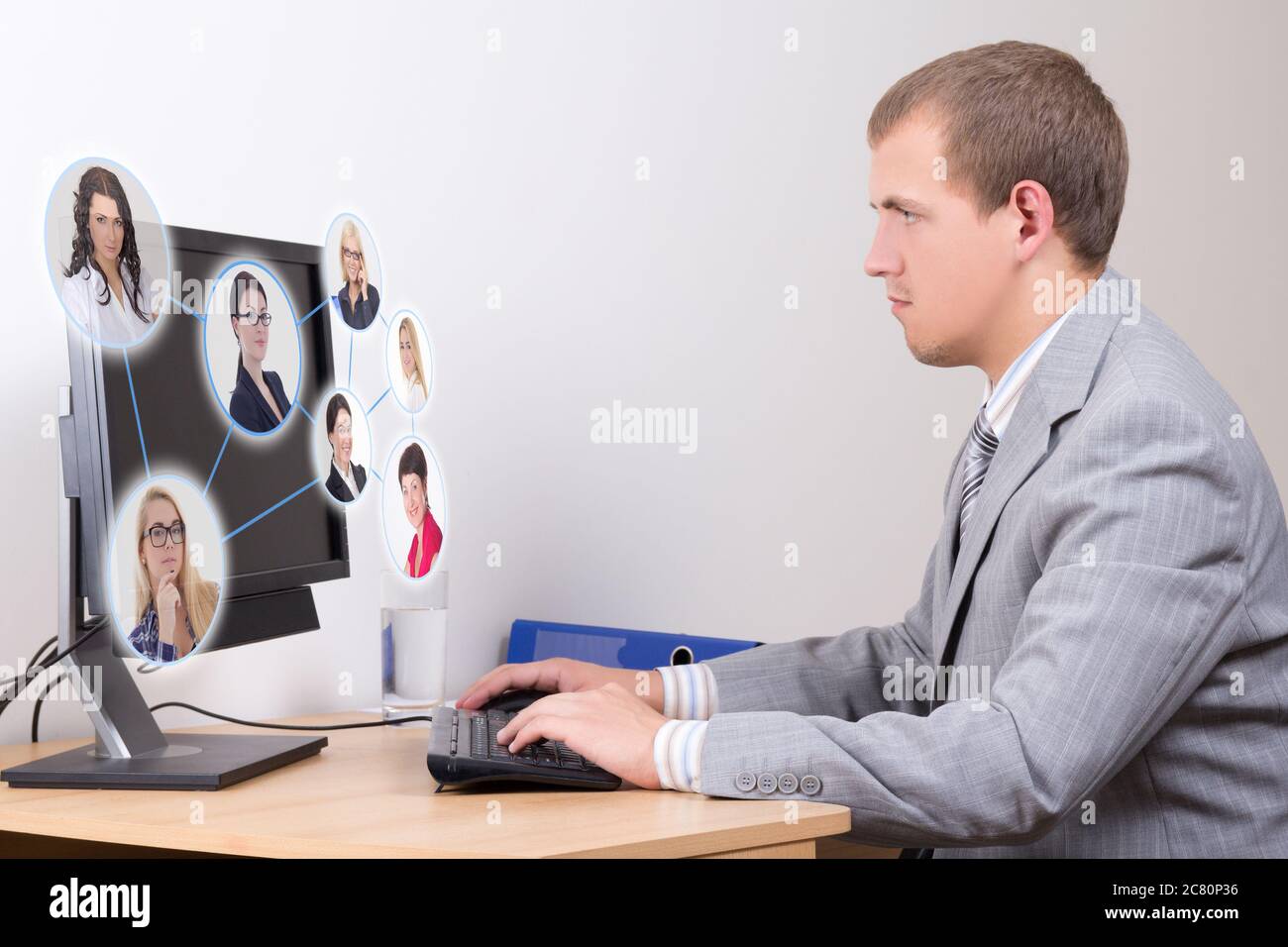 social network concept - young business man working with pc in office ...
